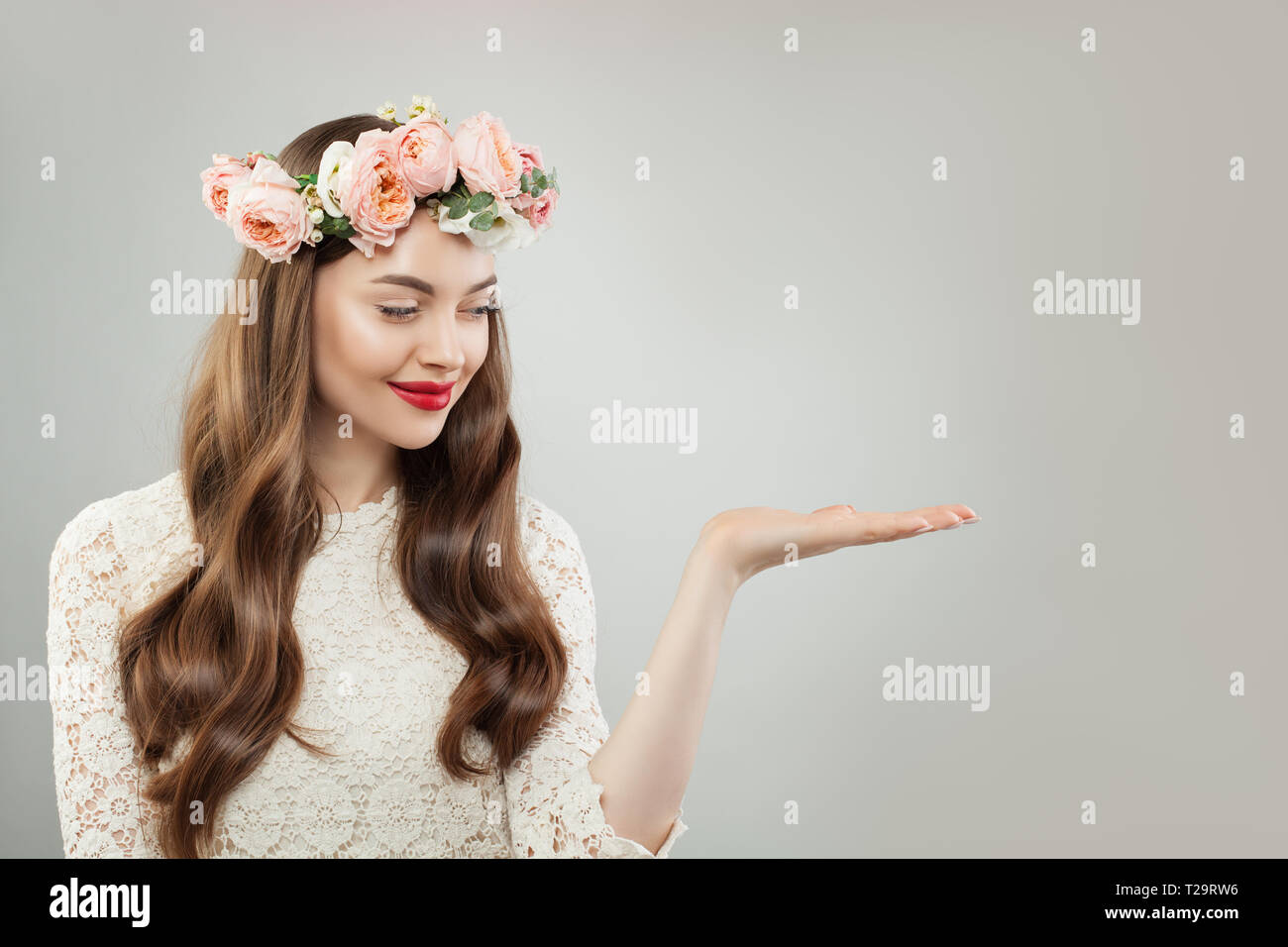 Young Model Woman Holding Empty Open Palm Hand. Pretty Girl with Clear ...