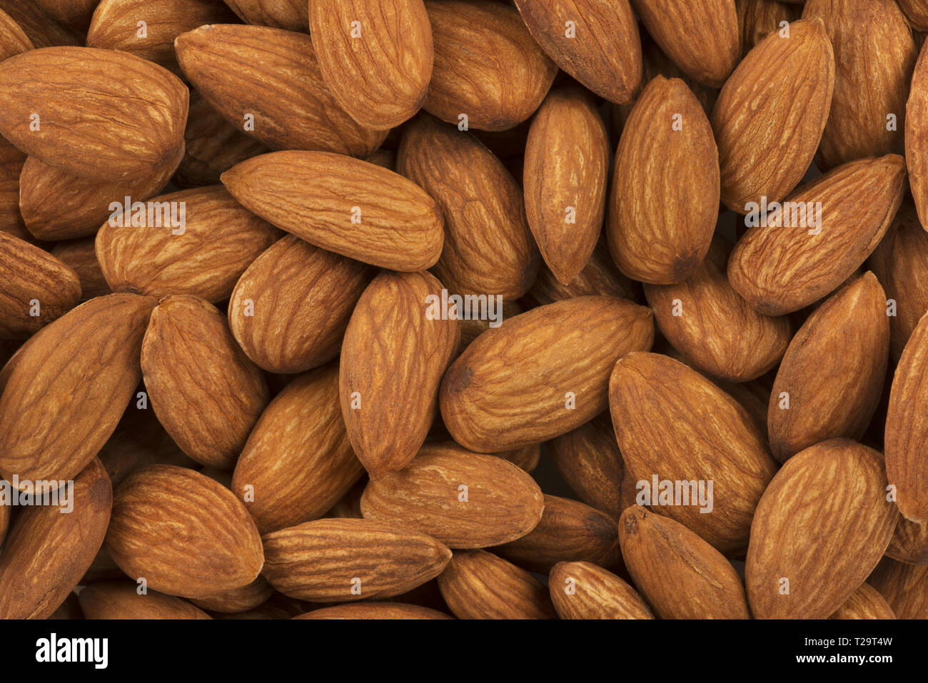 Almonds background. Full frame shot of almonds for sale in market. Copy ...