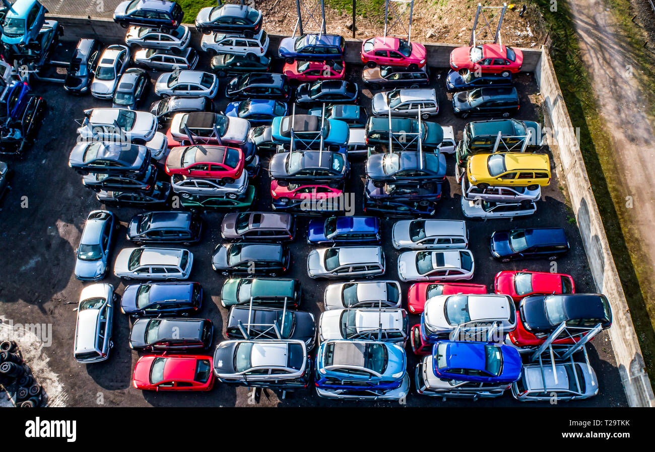 Lines of crushed cars wreck - in scrapyard before being shredded ...