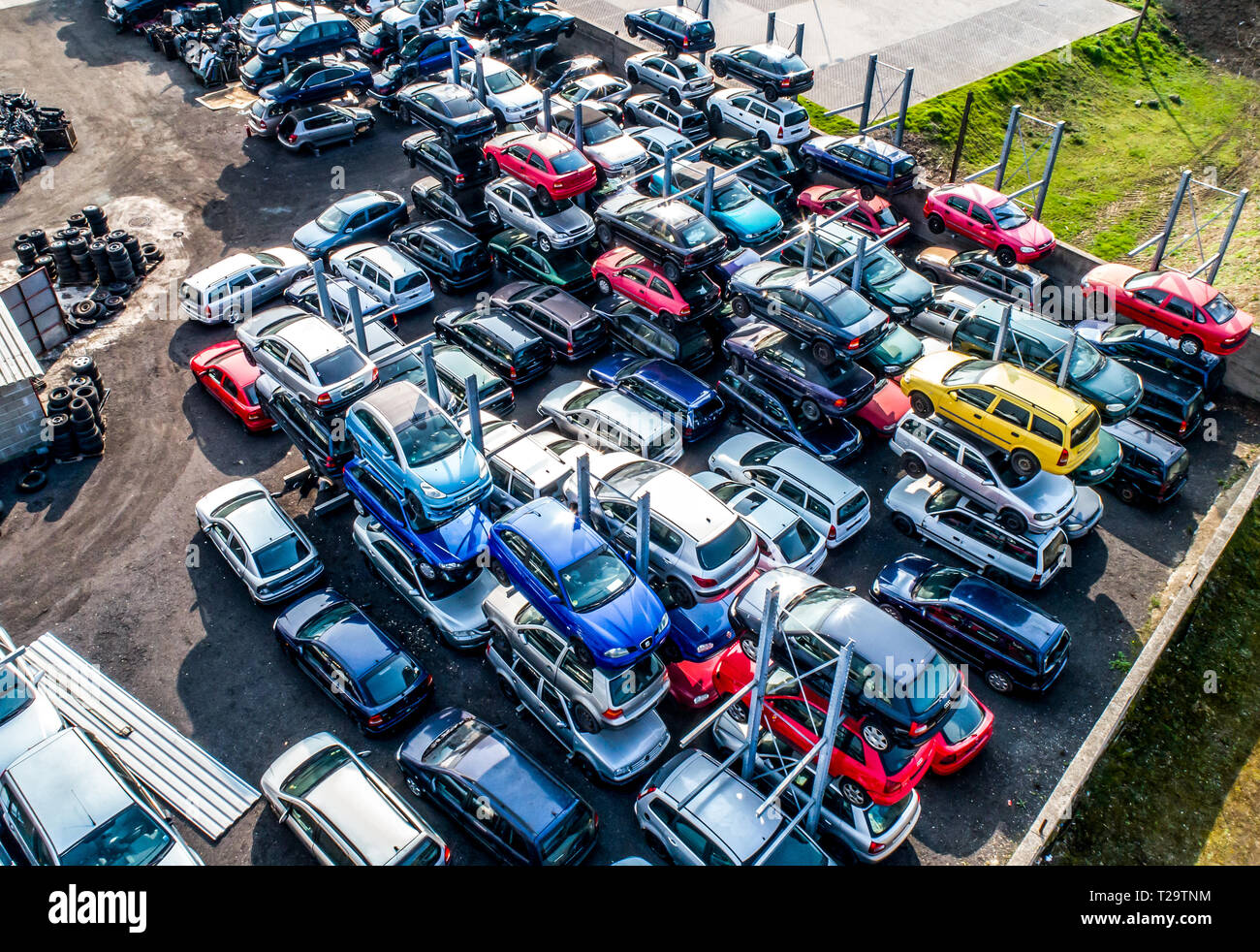 Lines of crushed cars wreck - in scrapyard before being shredded ...