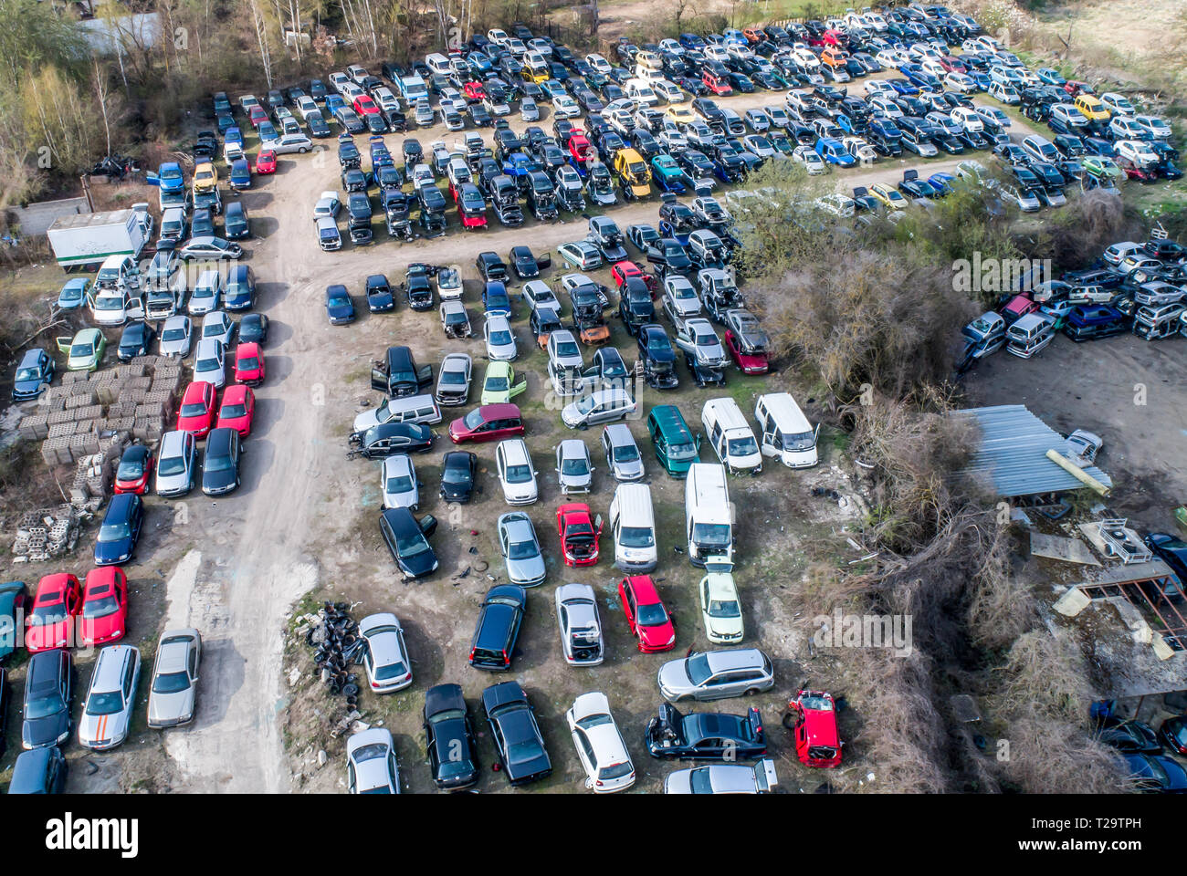 Lines of crushed cars wreck - in scrapyard before being shredded ...