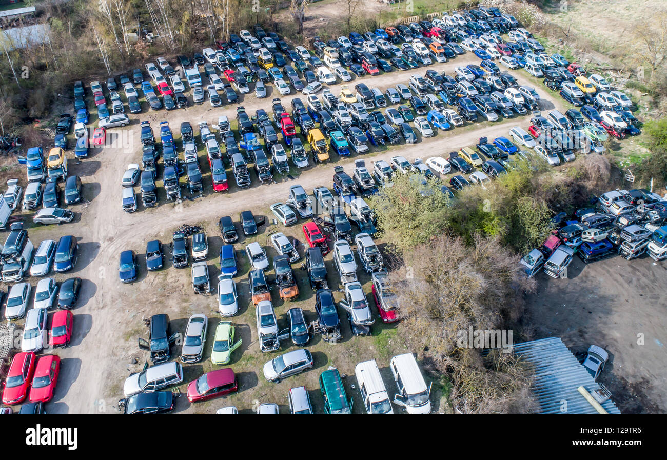 Lines of crushed cars wreck - in scrapyard before being shredded ...