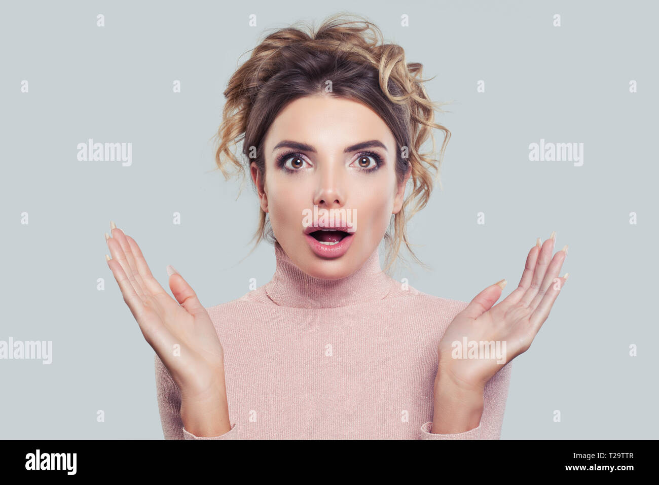 Surprised woman with mouth open. Shocked girl on background with copy ...