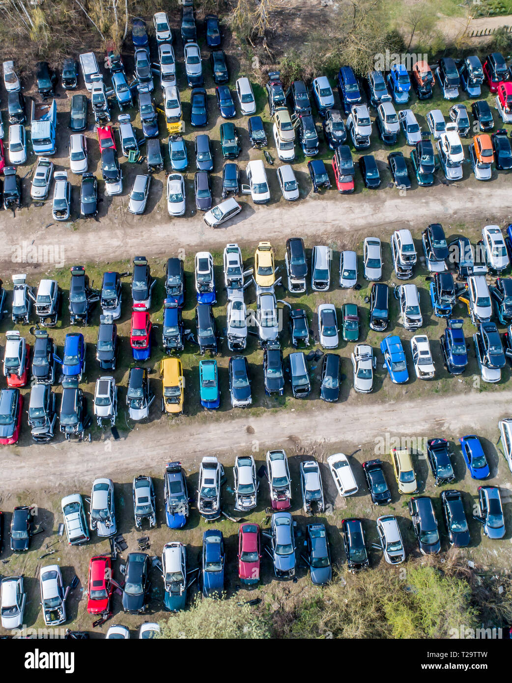 Lines of crushed cars wreck - in scrapyard before being shredded ...