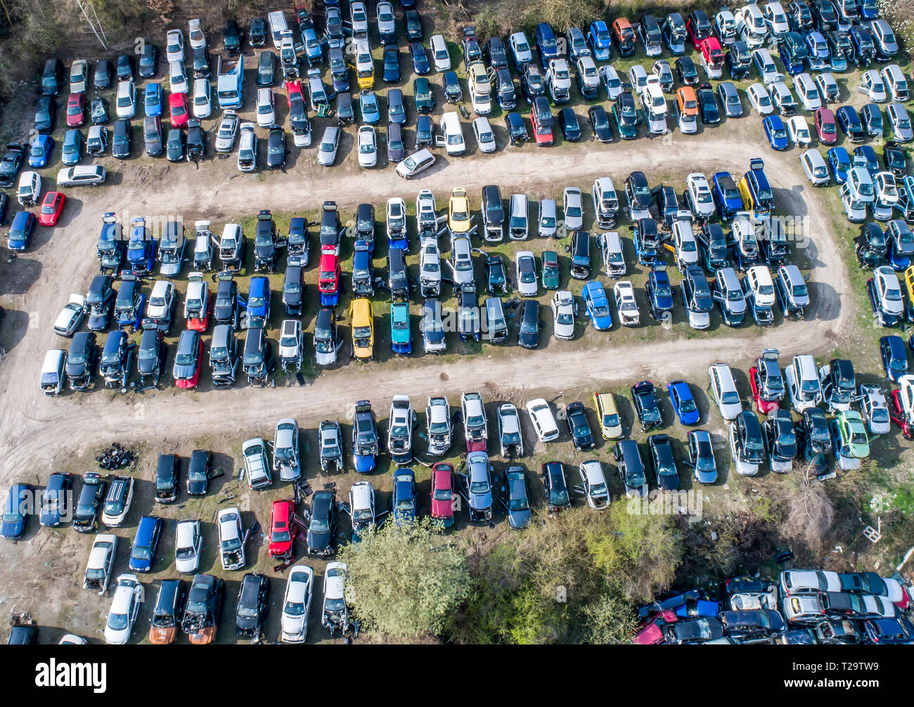 Lines of crushed cars wreck - in scrapyard before being shredded ...
