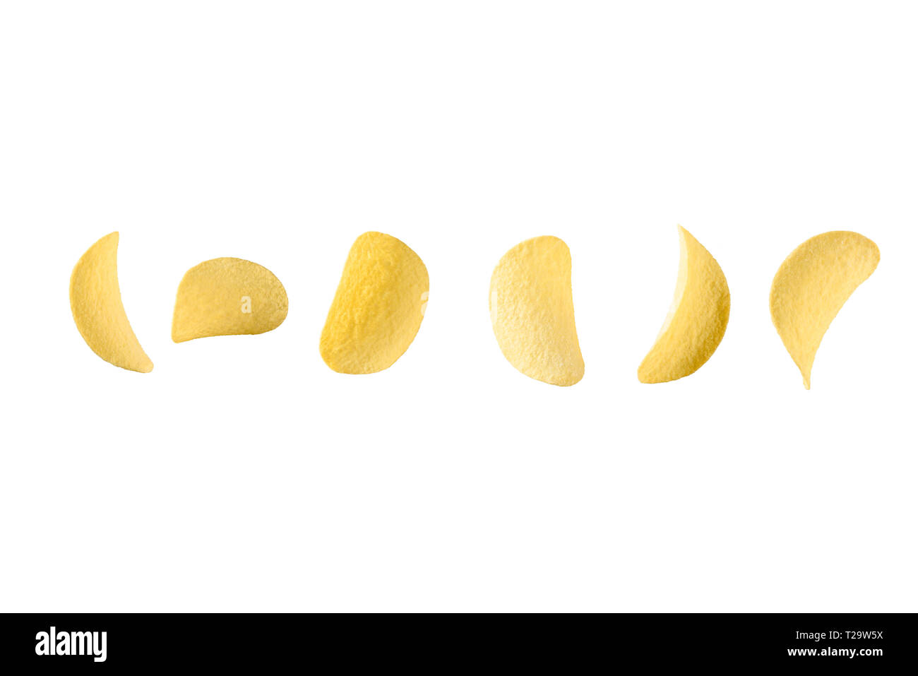 Crispy golden potato chips falling Cut Out Stock Images & Pictures - Alamy