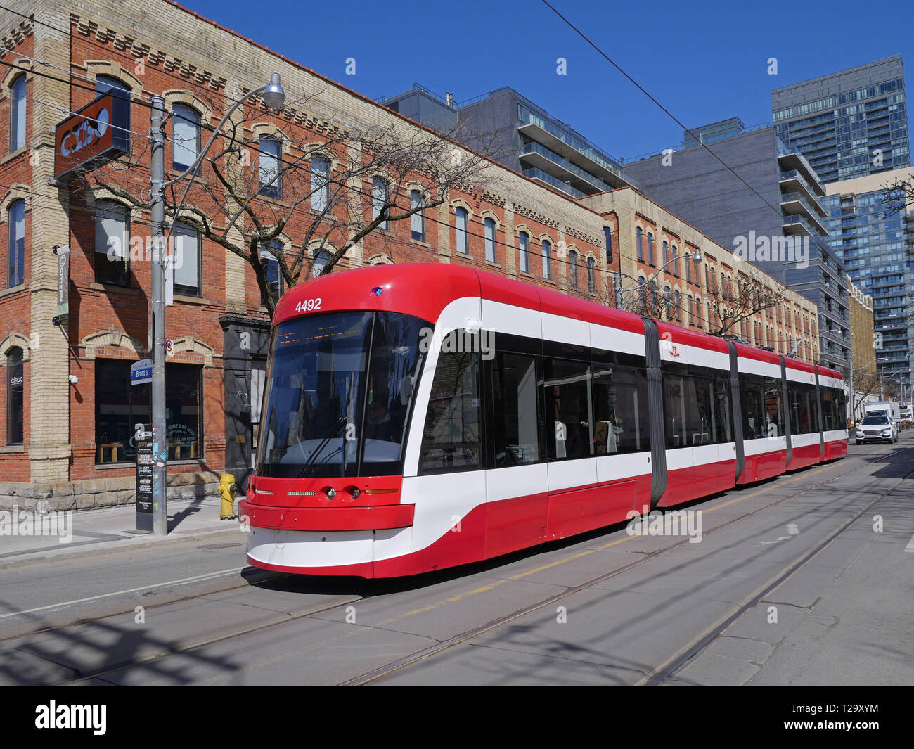 TORONTO - MARCH 2019: A modern streetcar travels along King Street in ...