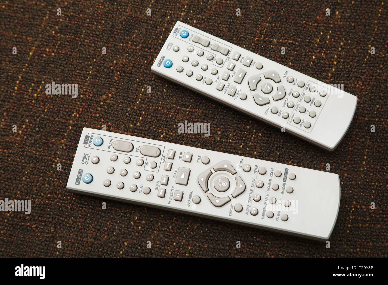 Remote controls for tv and dvd Stock Photo - Alamy