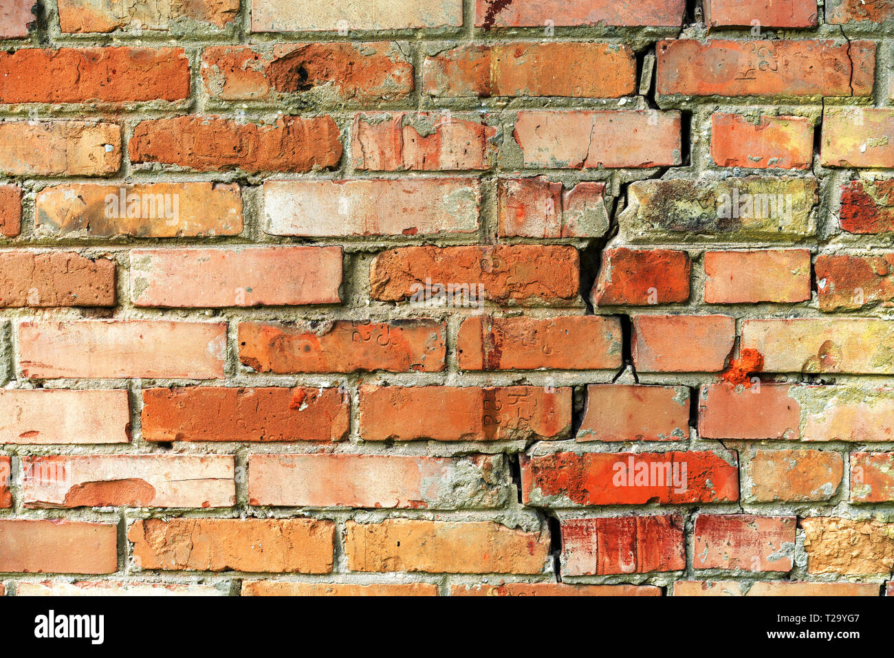 old wall of yellow and red brick Stock Photo - Alamy