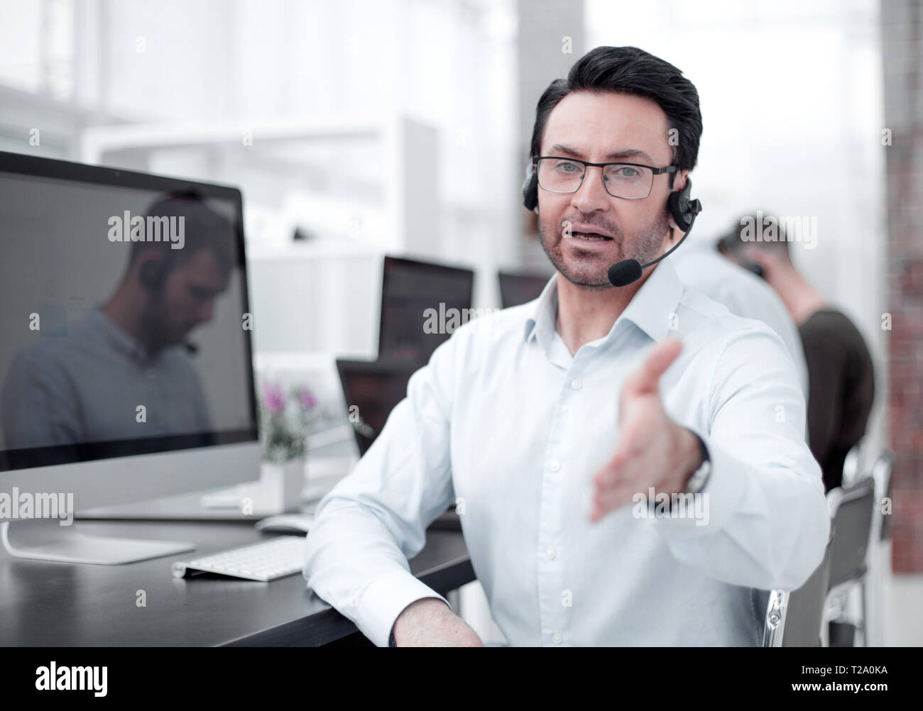 operator call center holding out his hand for a handshake Stock Photo ...
