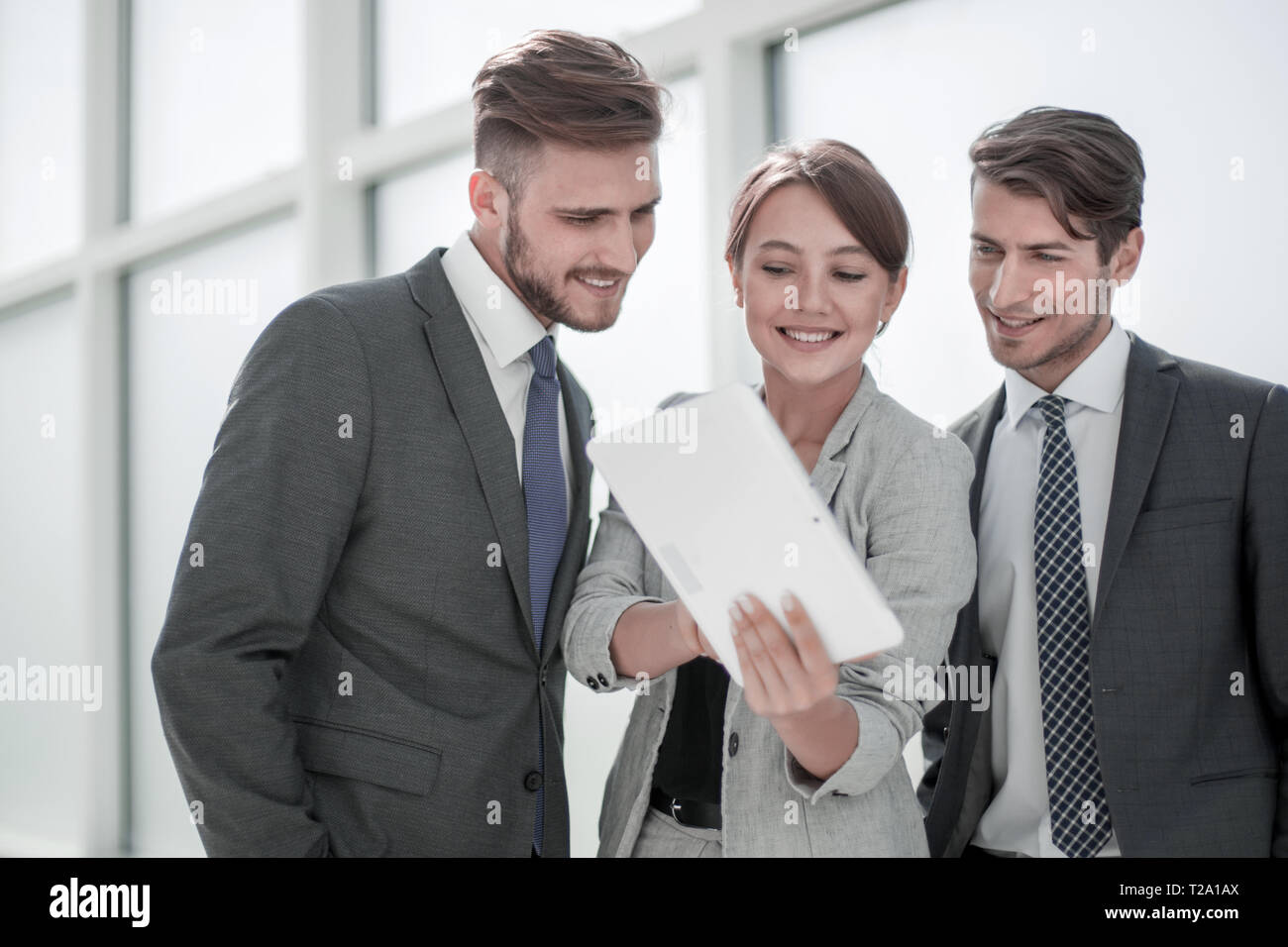 modern business team using tablet computer to work with financial data ...