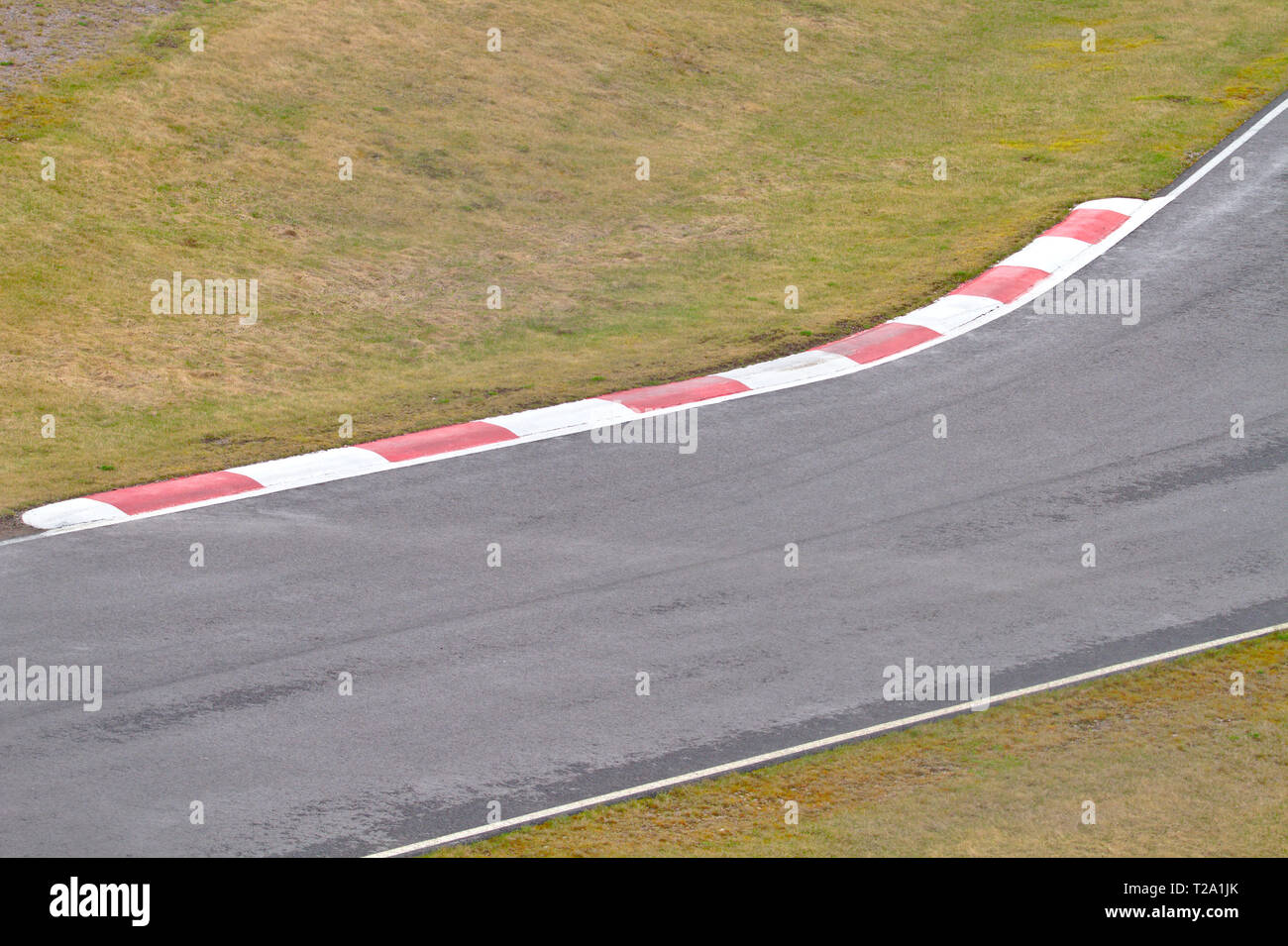 Fast left curve on a race track Stock Photo - Alamy