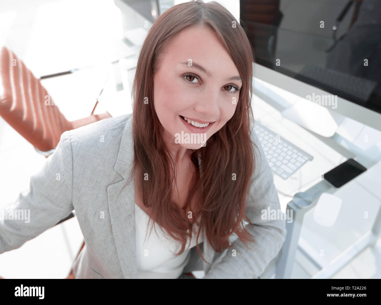modern business woman sitting at her Desk Stock Photo - Alamy