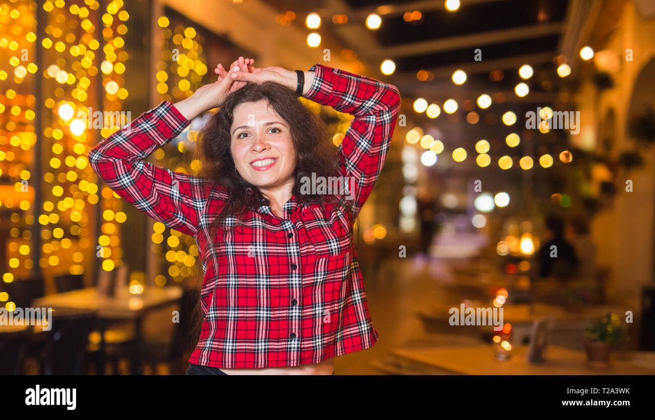 Nightlife, party and people concept - Beautiful young woman is have fun ...