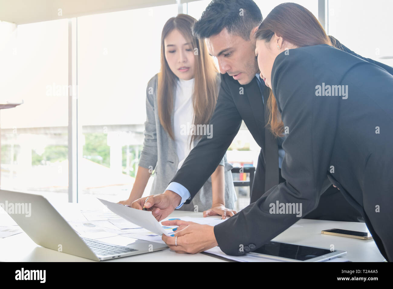 Managers reviewing reports hi-res stock photography and images - Alamy
