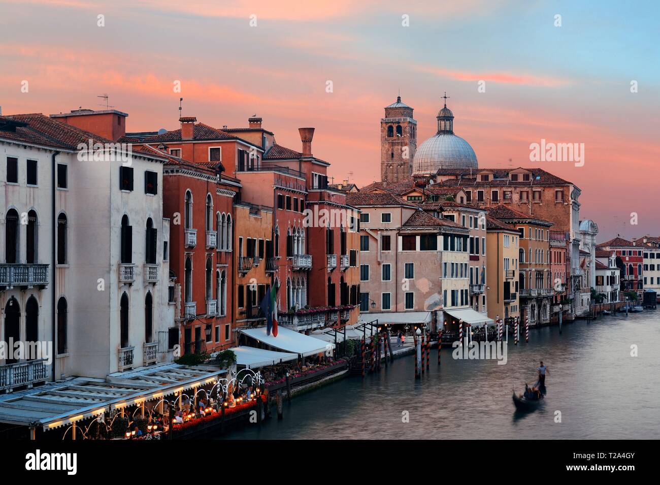 Venice grand canal sunset view with Gondola and historical buildings ...