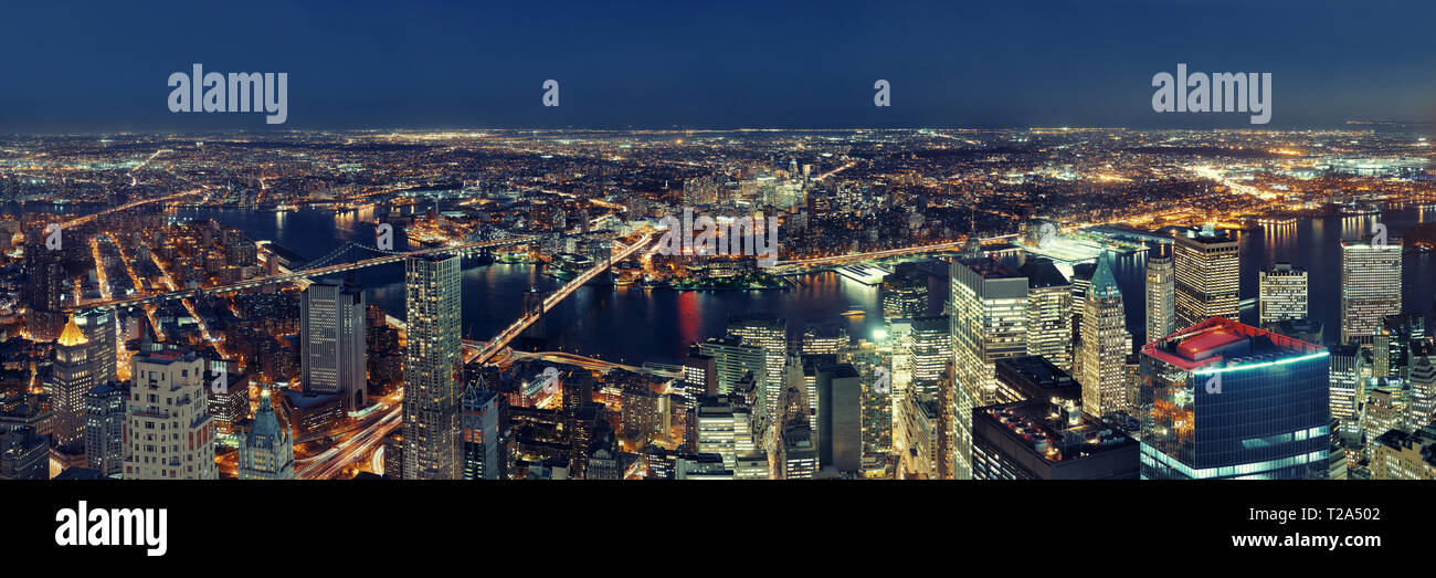 Rooftop night panorama view of New York City downtown with urban ...