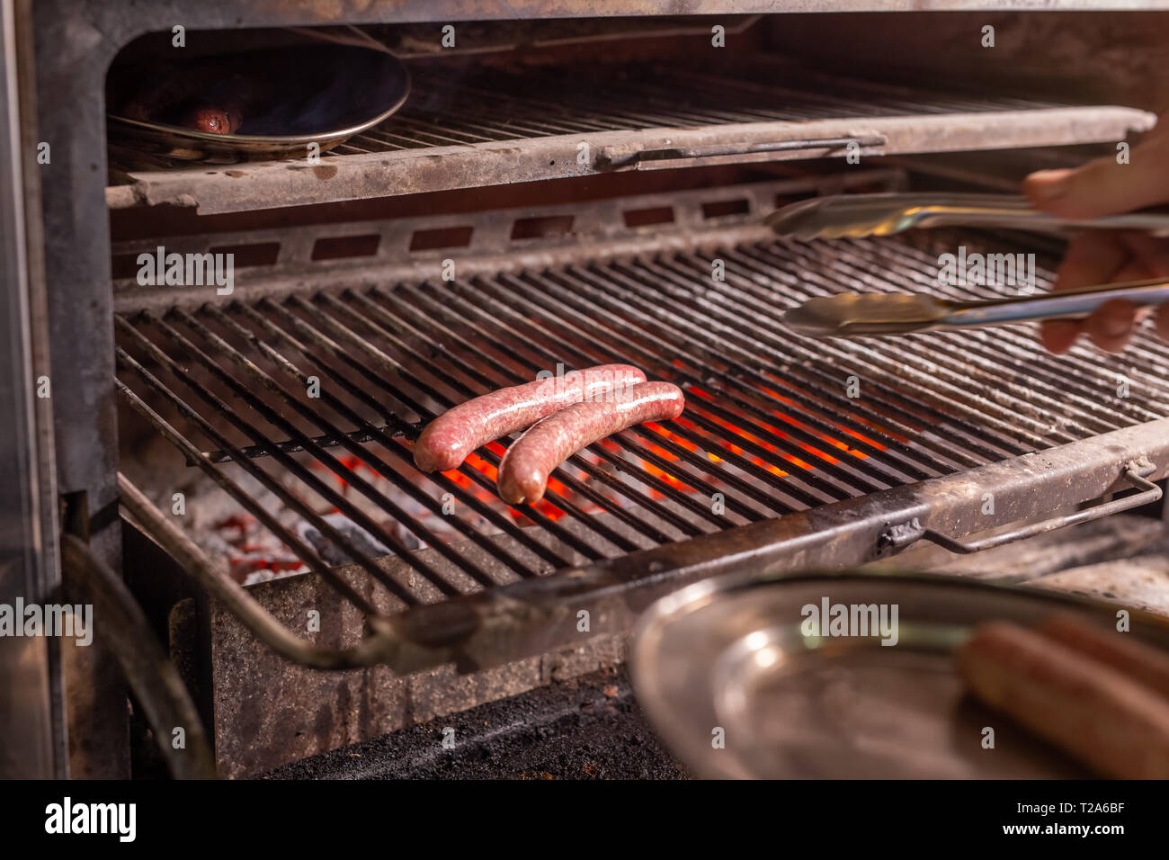 food, delicious and meat concept - roasting horse meat sausages grilled ...