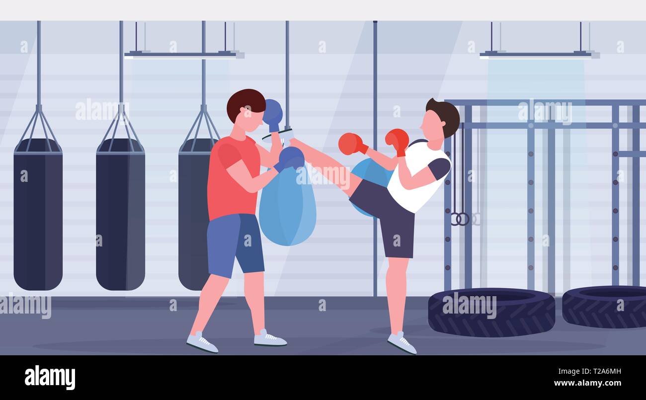 two boxers training kick boxing exercises fighters in gloves practicing ...