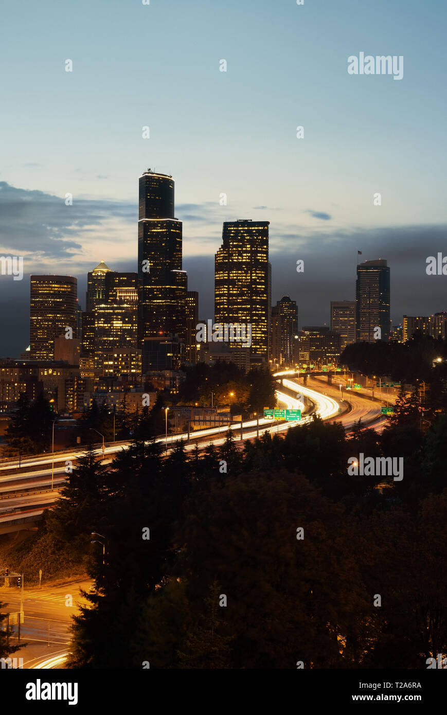 Seattle city view with urban architecture and traffic light trail at ...