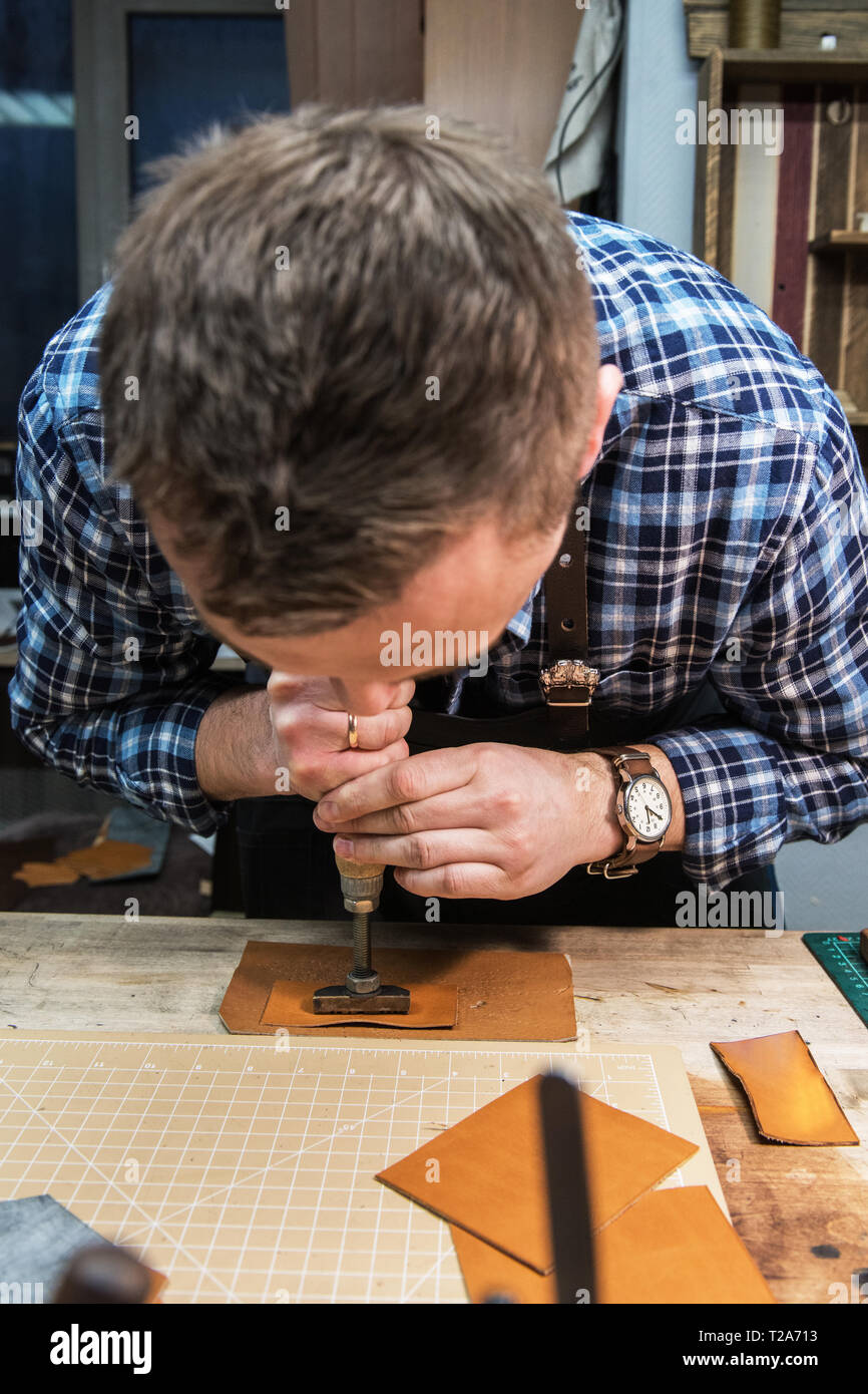 Concept of handmade craft production of leather goods Stock Photo - Alamy