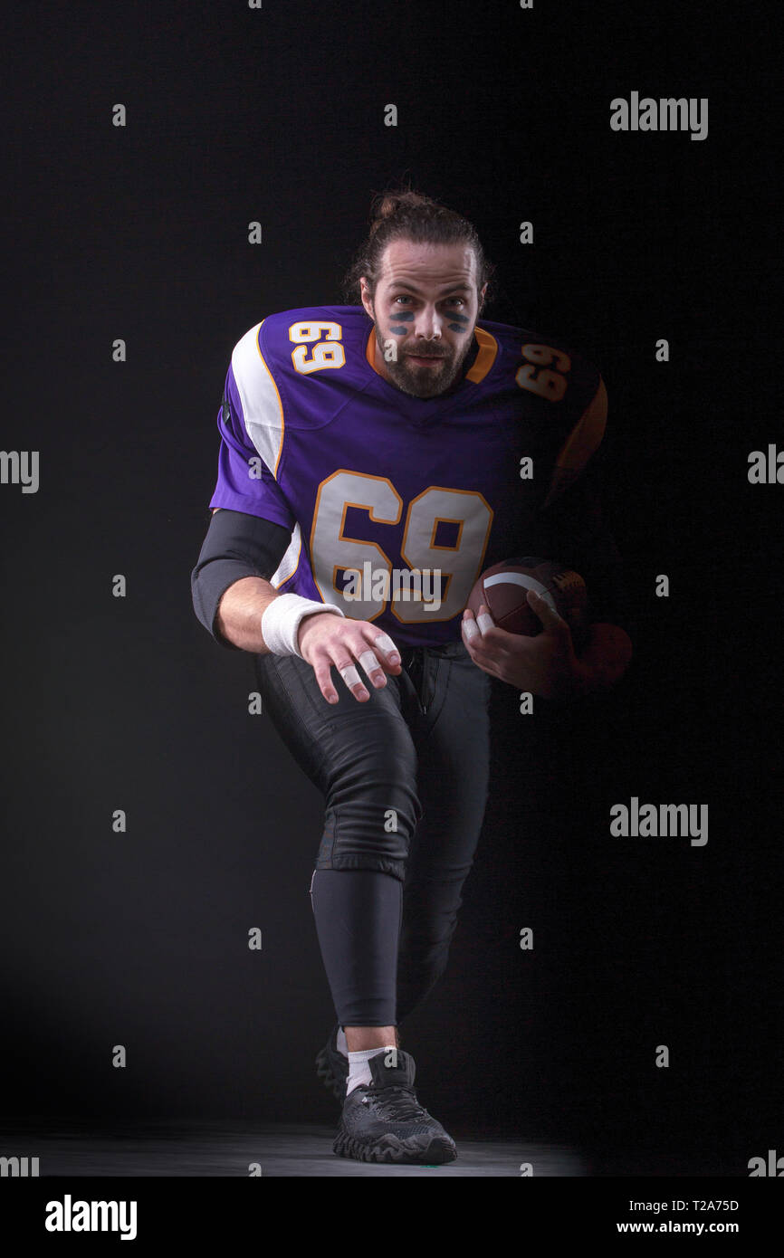 High jump of American Footballer Stock Photo - Alamy
