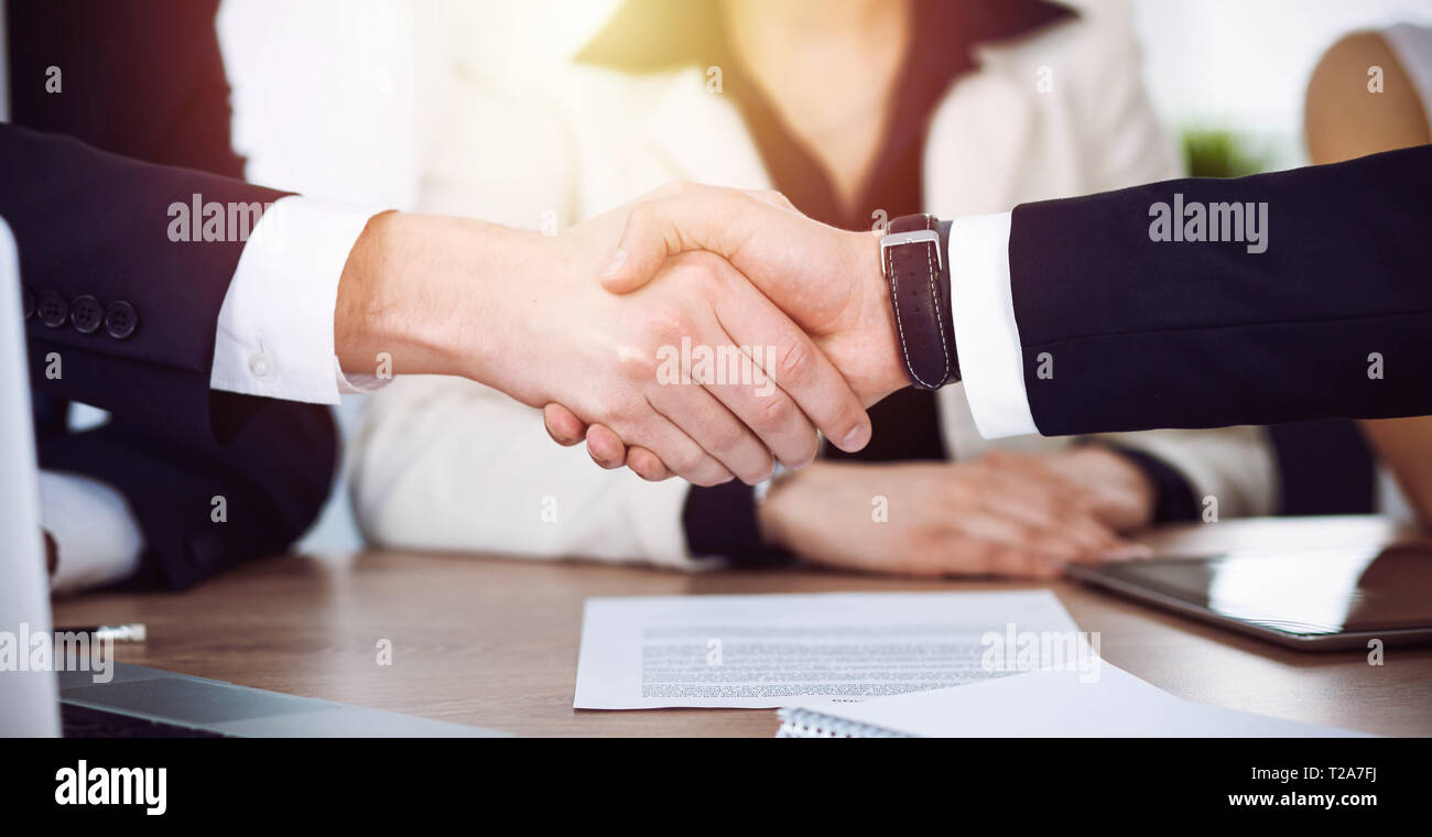 Business people shaking hands at meeting or negotiation in the office ...