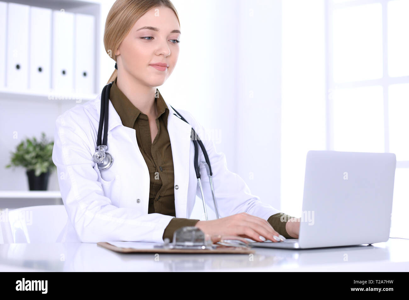 Female therapist typing laptop hi-res stock photography and images - Alamy