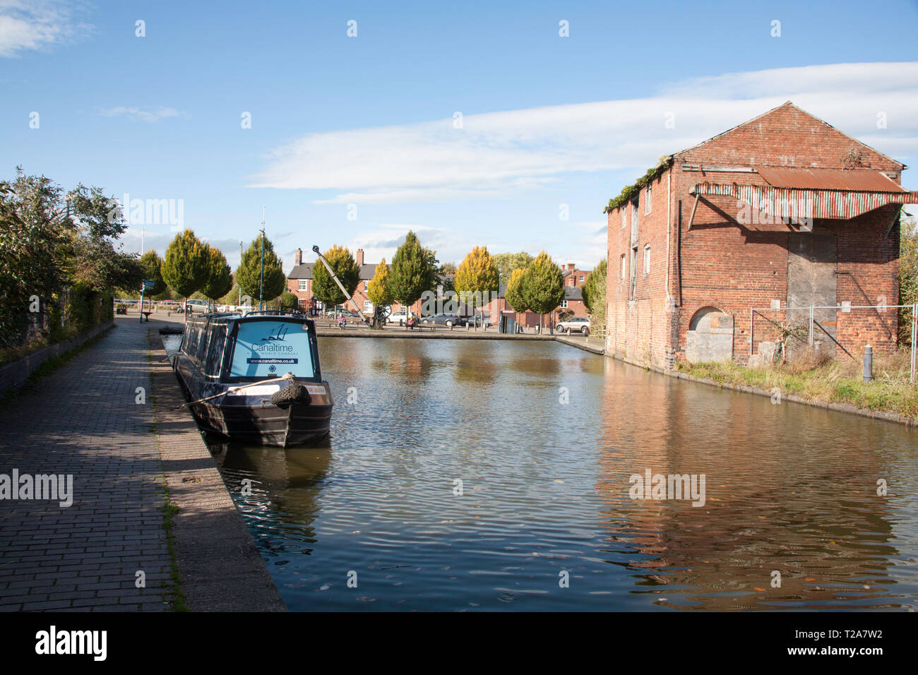 Narrow boats moored at Ellesmere Canal Basin on the Llangollen Canal at ...