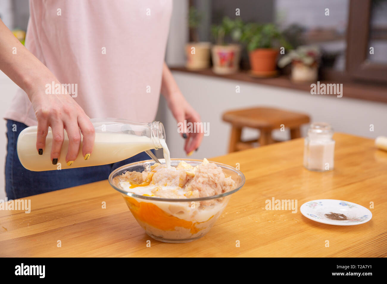 Woman cooking milk water hi-res stock photography and images - Alamy