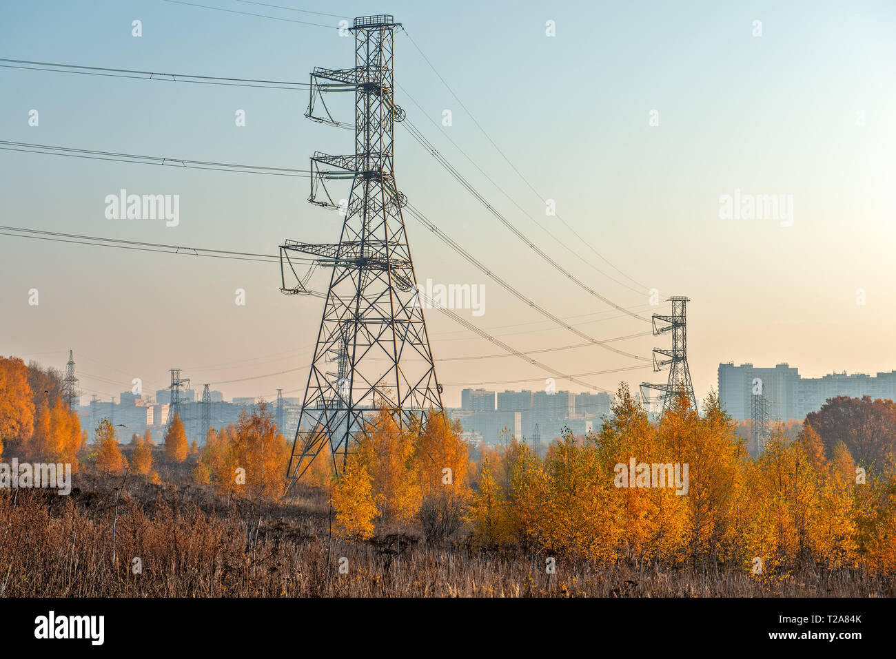 Autumn suburban landscape with power line and residential district on ...