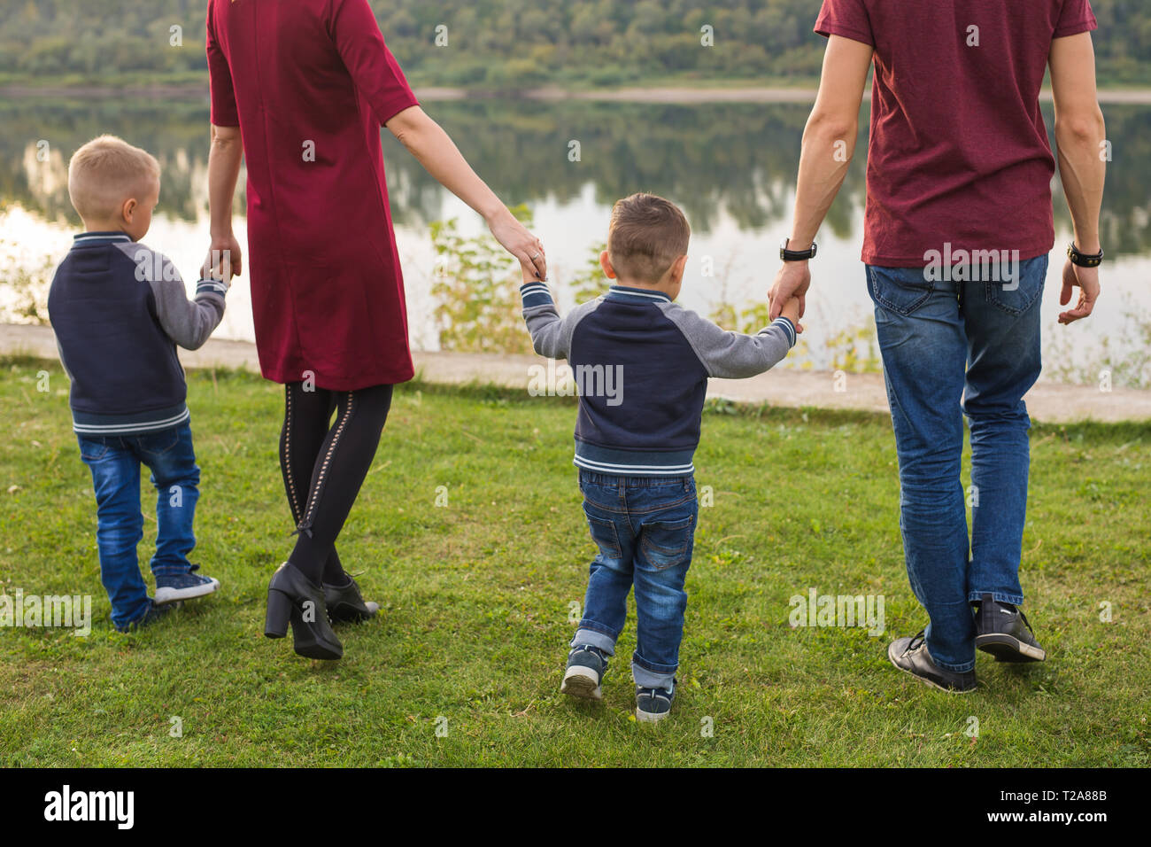 Parenthood, childhood and family concept - Parents and two male ...