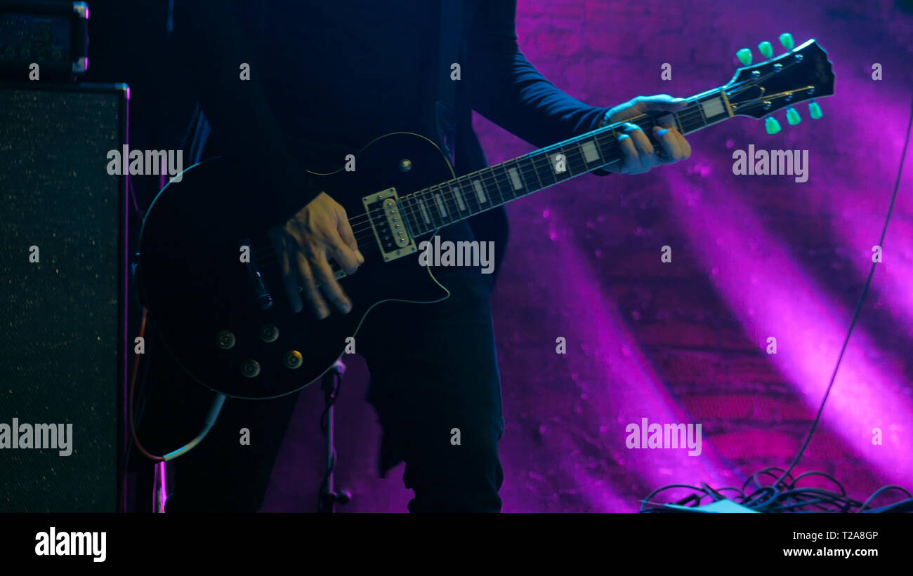 Guitar player on stage Stock Photo - Alamy