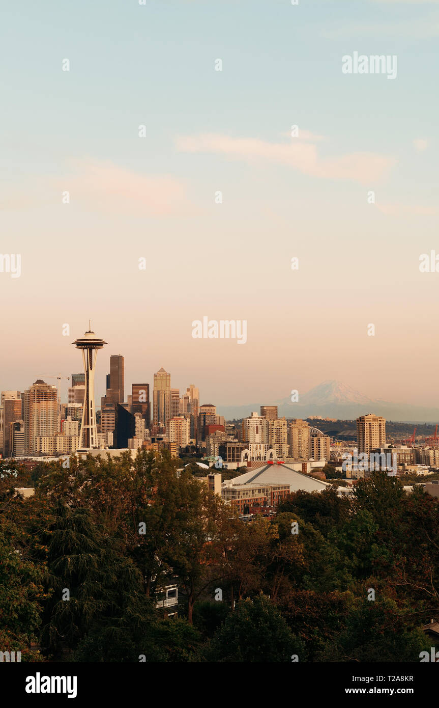 Seattle city skyline with Mt Rainier at sunset with urban office ...