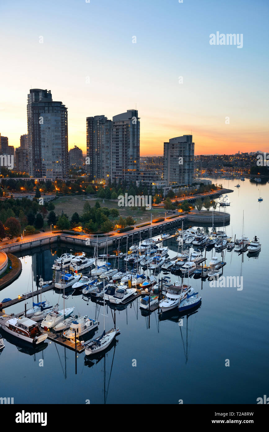 Vancouver harbor view with urban apartment buildings and bay boat in ...