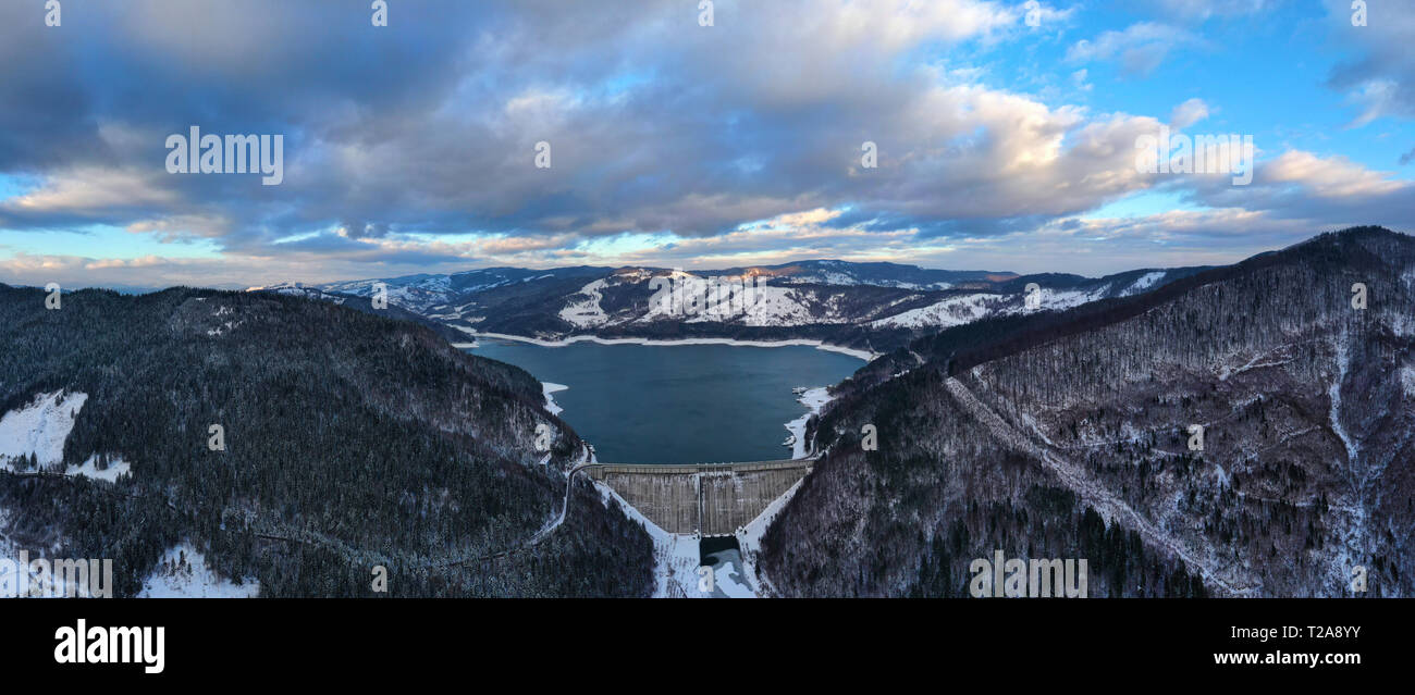 Aerial view of energy dam, winter landscape at Bicaz Dam in Romania ...