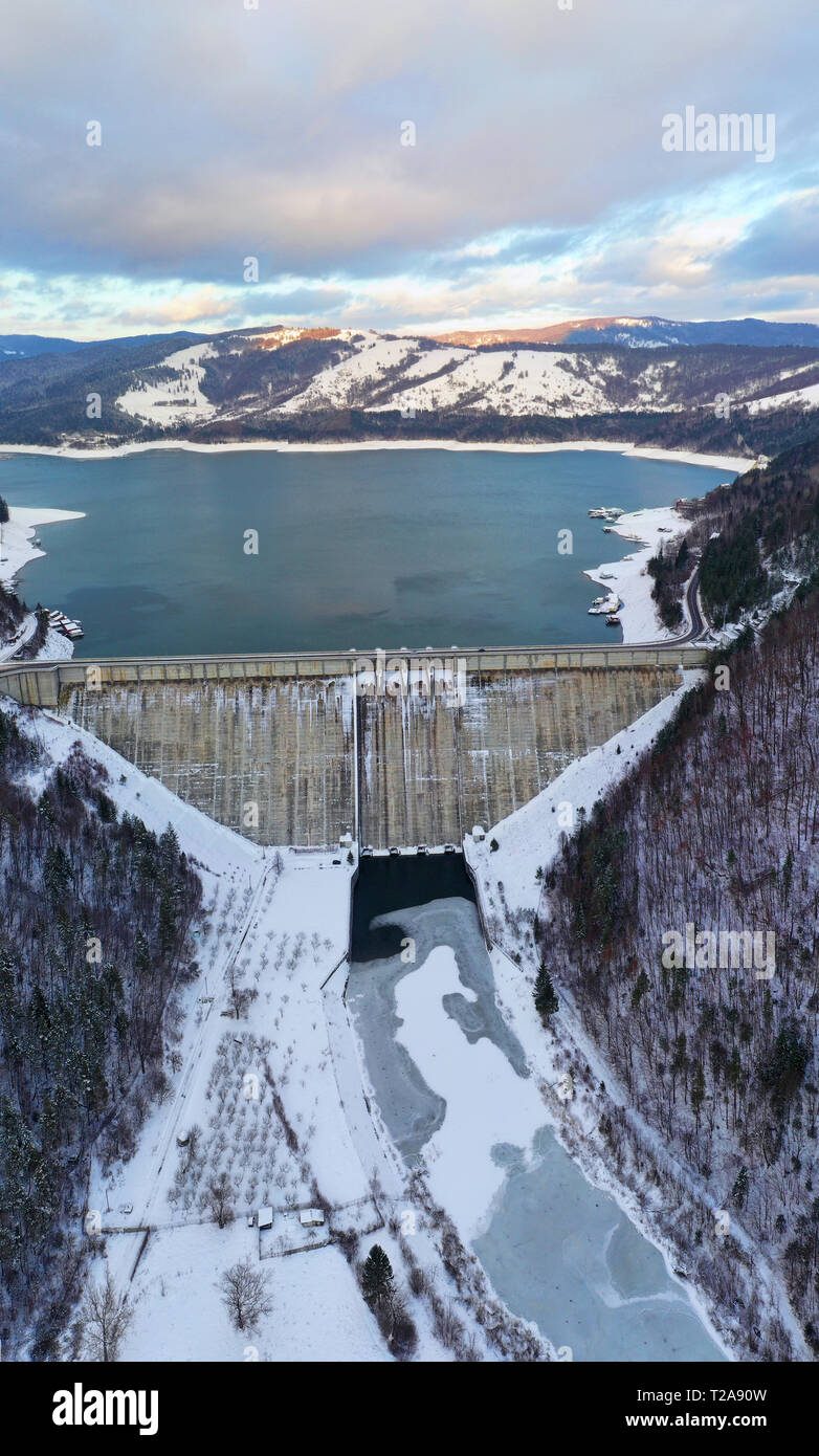 Water barriere dam viewed from above, dam and road on it in the winter ...
