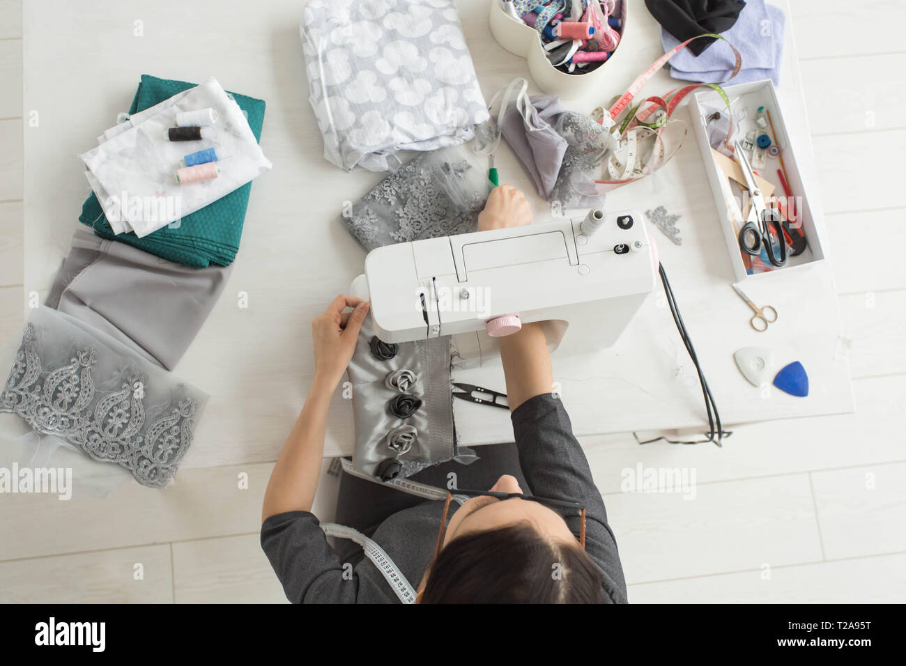 Tailor, fashion and seamstress concept - young female fashion designer ...