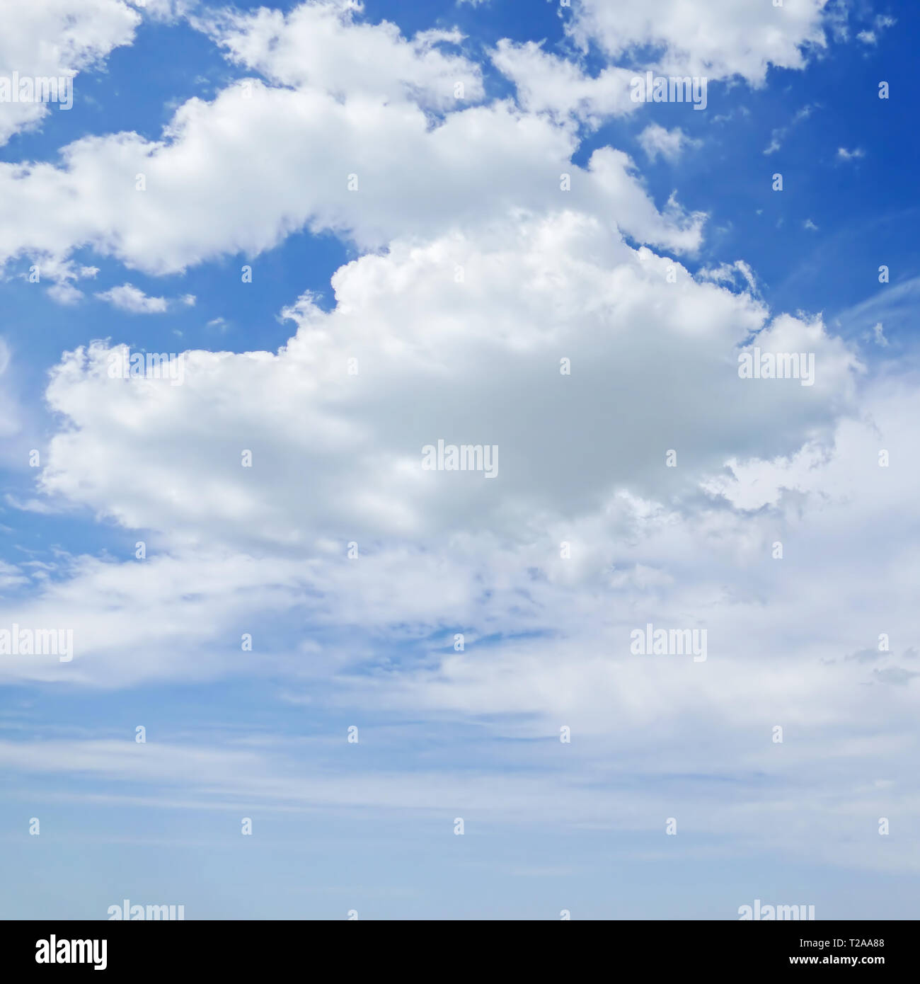 Light fluffy clouds against blue sky Stock Photo - Alamy