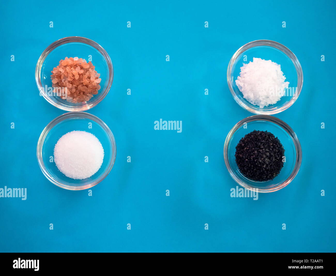 Crystal bowls with himalayan salt, black hawaii salt, common salt and ...