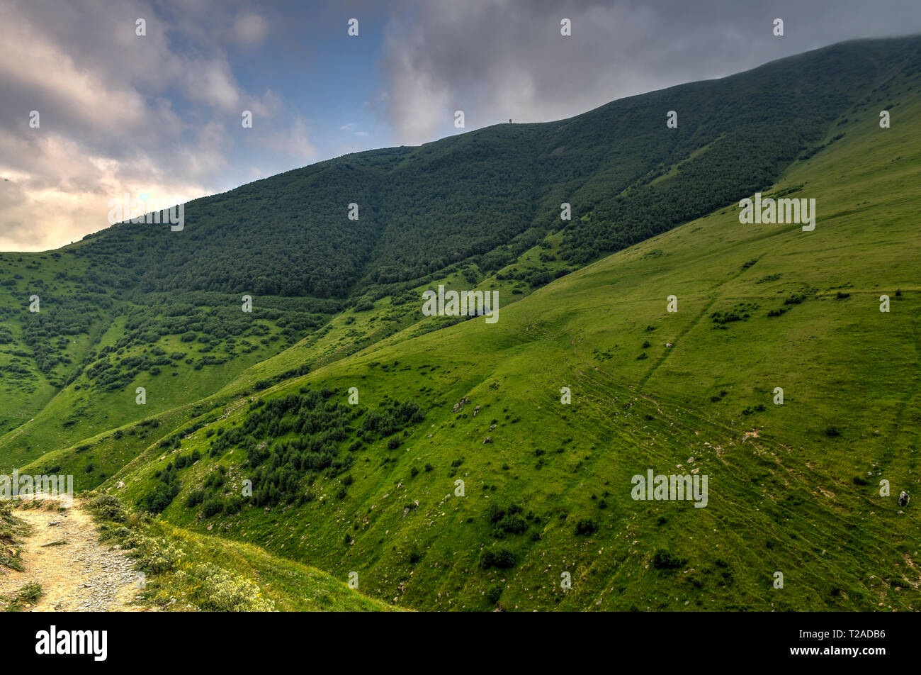 Hilly landscape near the village of Gergeti in Georgia, under Mount ...
