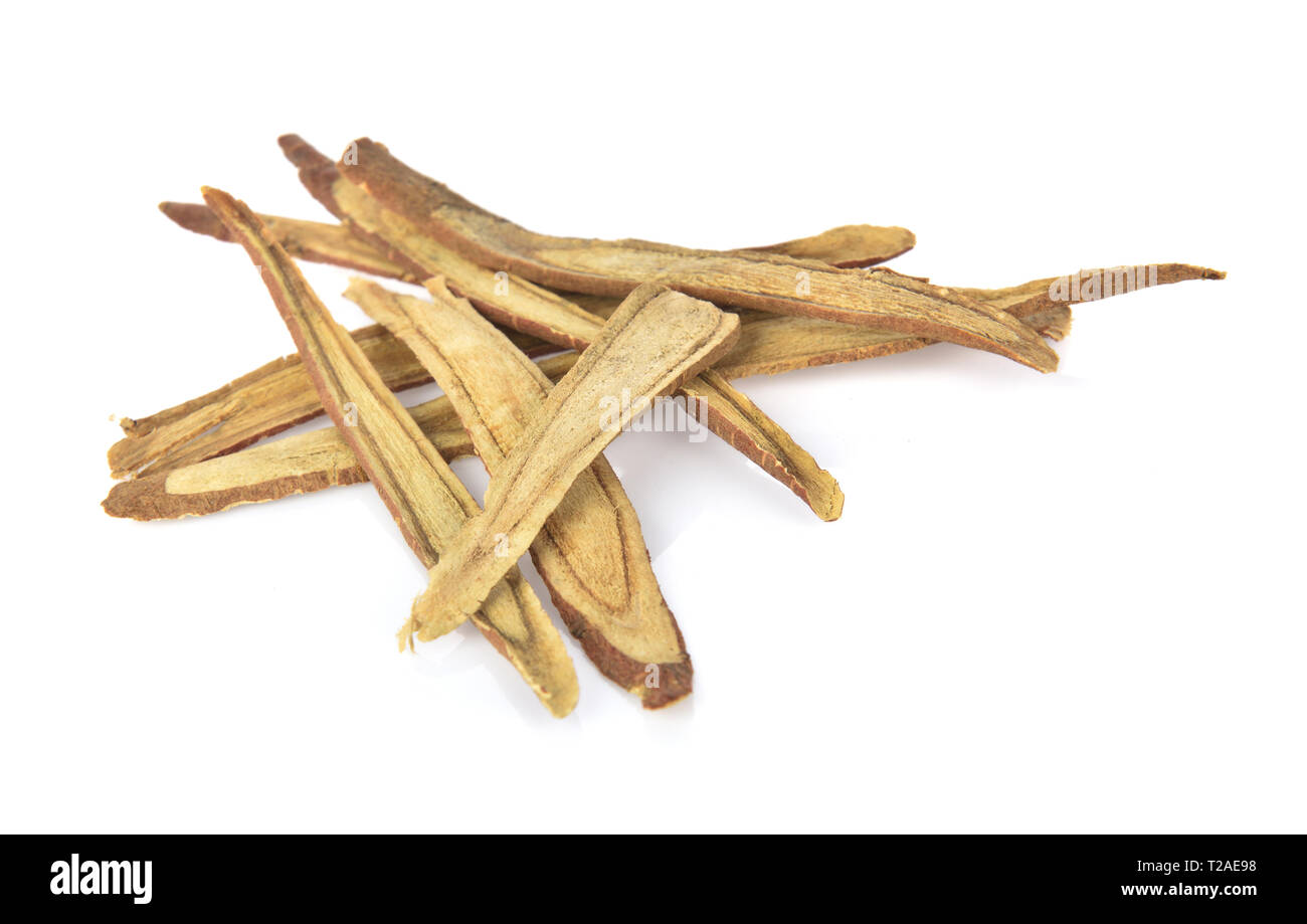 Slice Licorice roots on white background Stock Photo - Alamy
