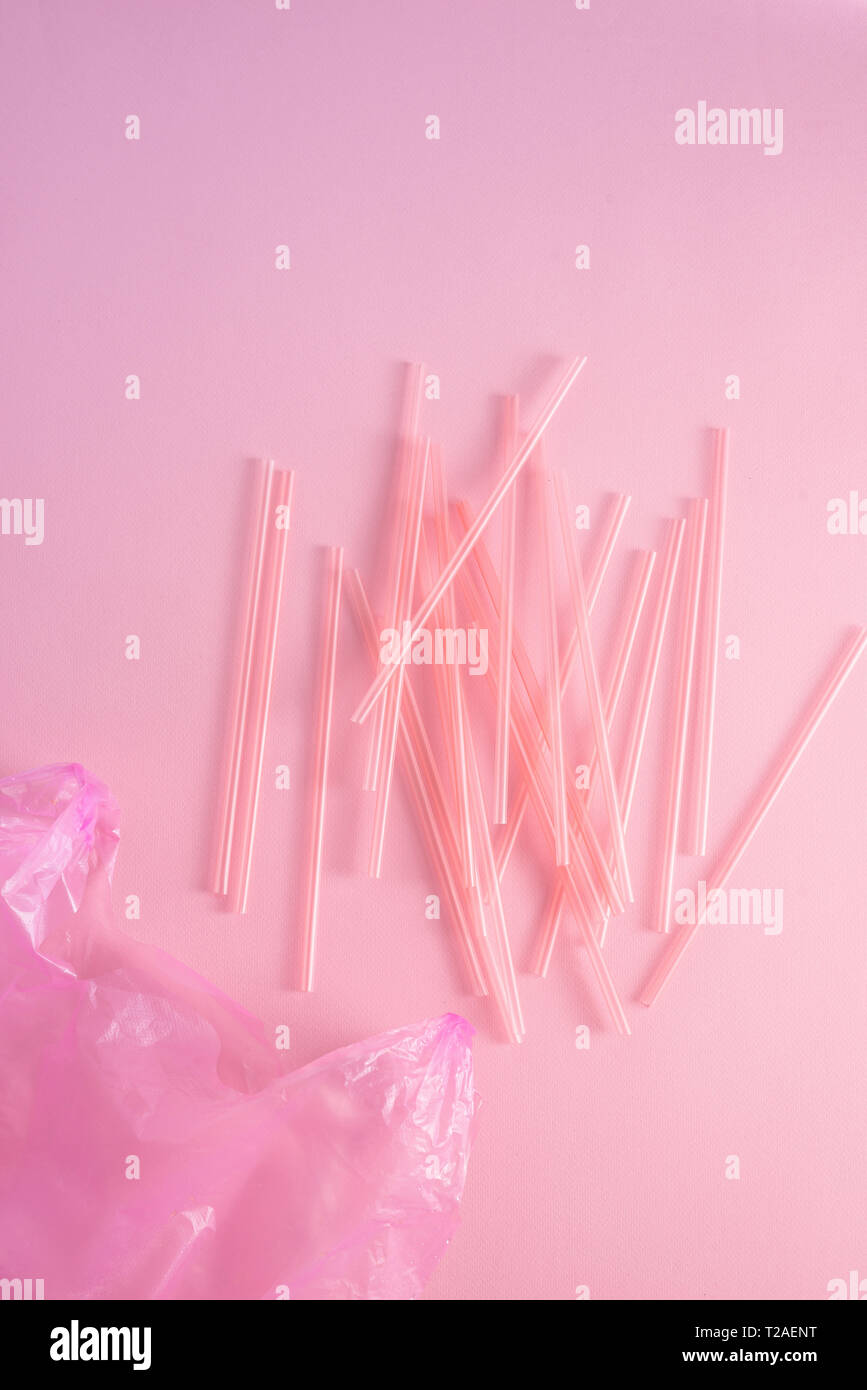 Closeup of colorful plastic waste in a pink garbage bag as recyclable ...