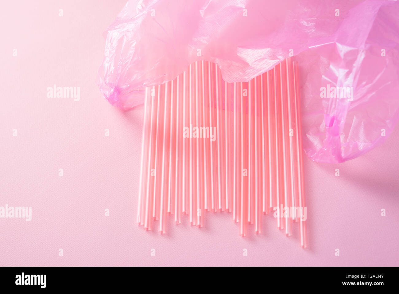 Closeup of colorful plastic waste in a pink garbage bag as recyclable ...