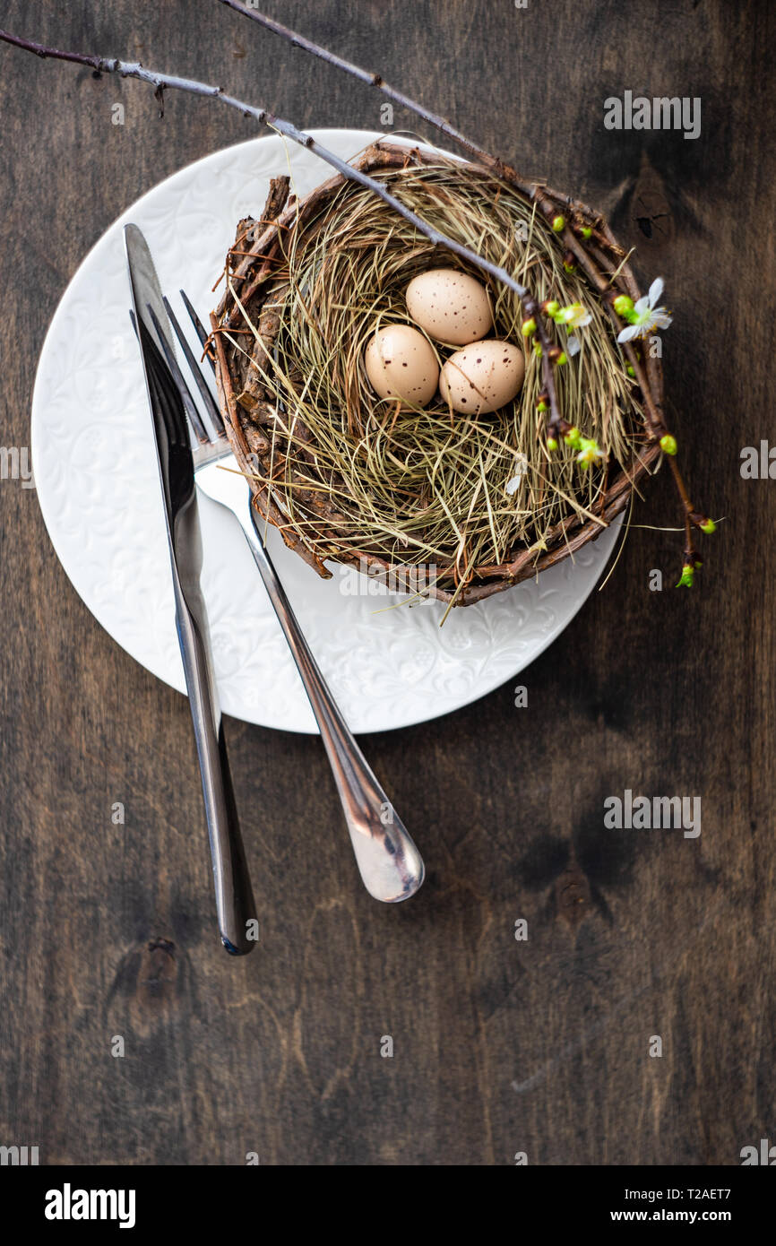 Easter holiday table setting on rustic background with copy space Stock ...