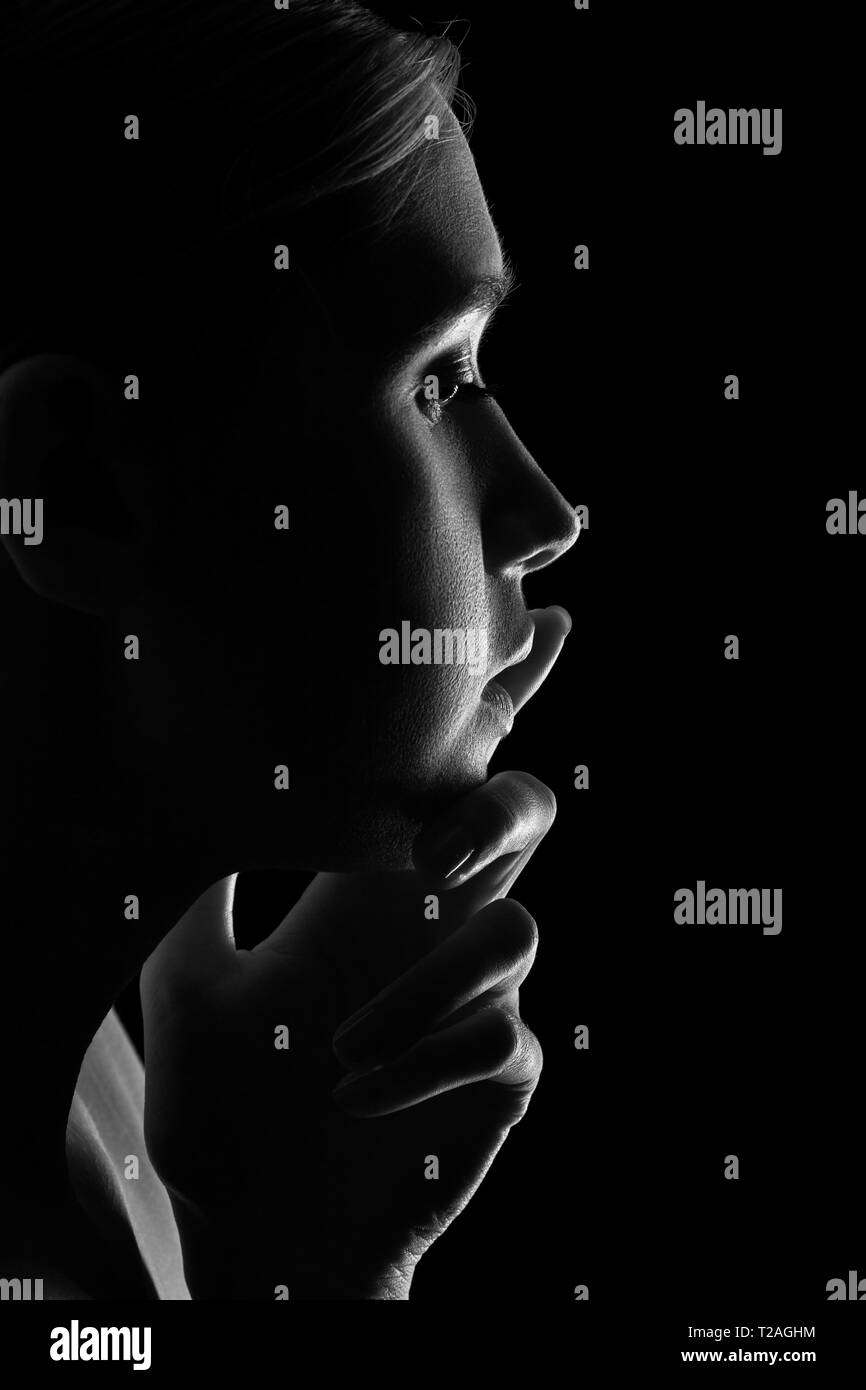 sad female profile silhouette on black background, monochrome Stock ...