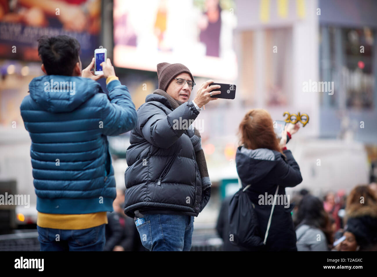 New York Manhattan tourist posing for photos in Times Square USA Stock ...