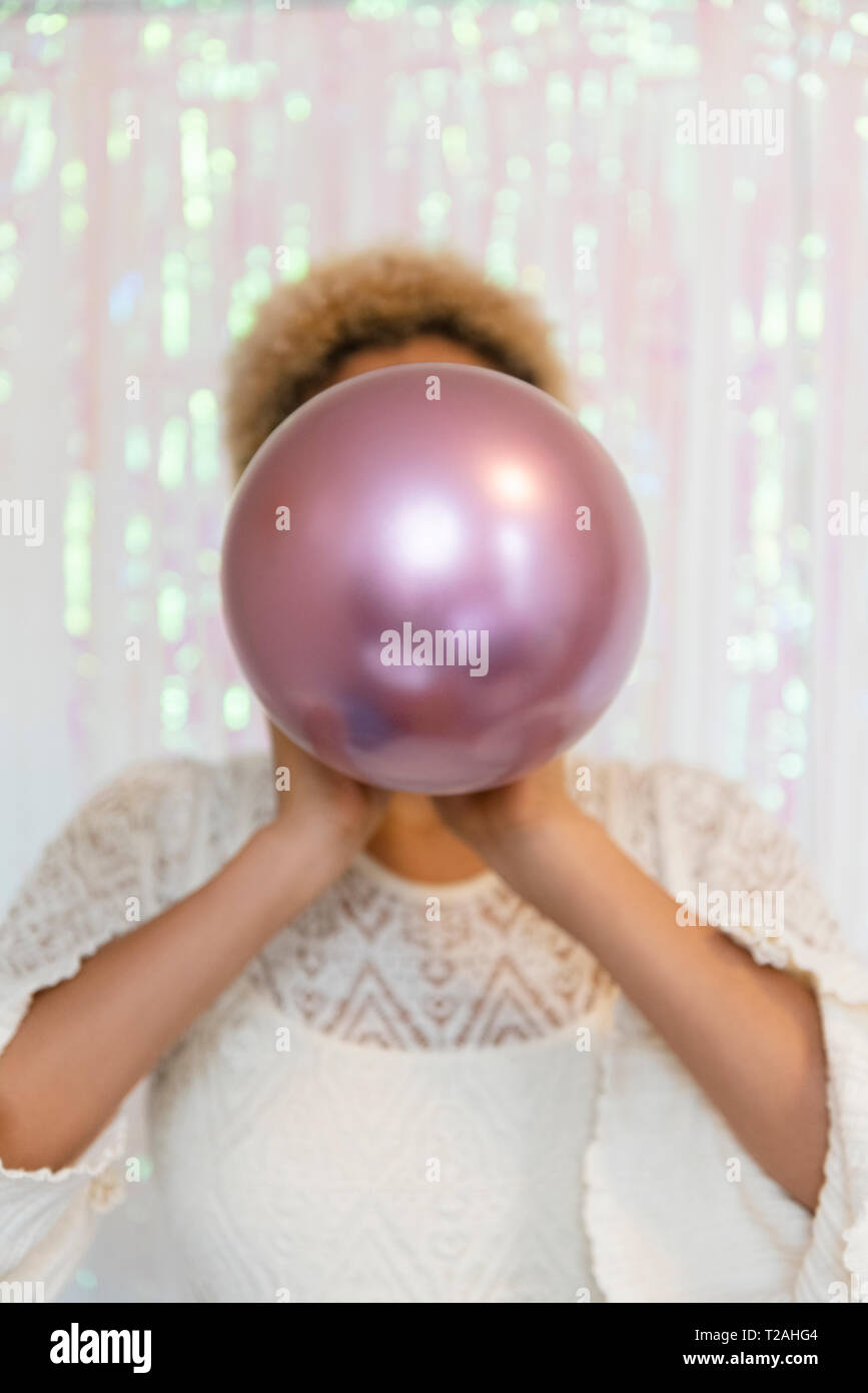 Woman inflating balloon hi-res stock photography and images - Alamy