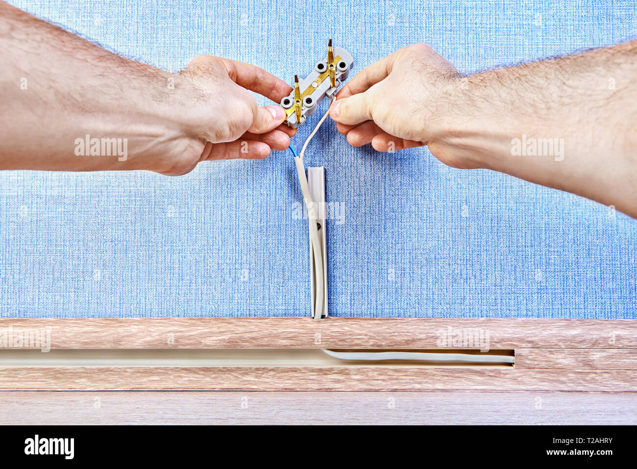 Electrician is installing an electrical 2-wire receptacle with no ...