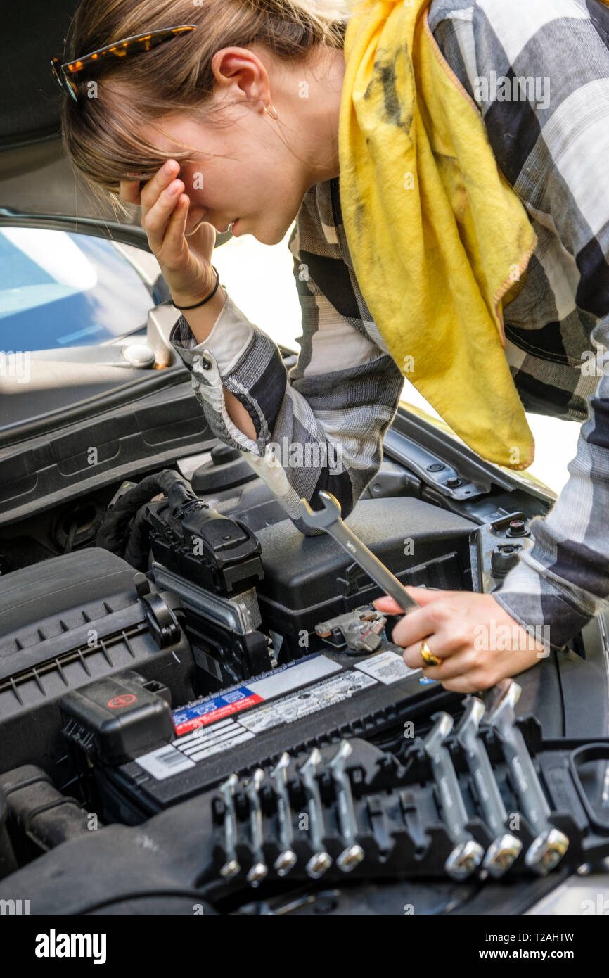 Young person repairing car hi-res stock photography and images - Alamy
